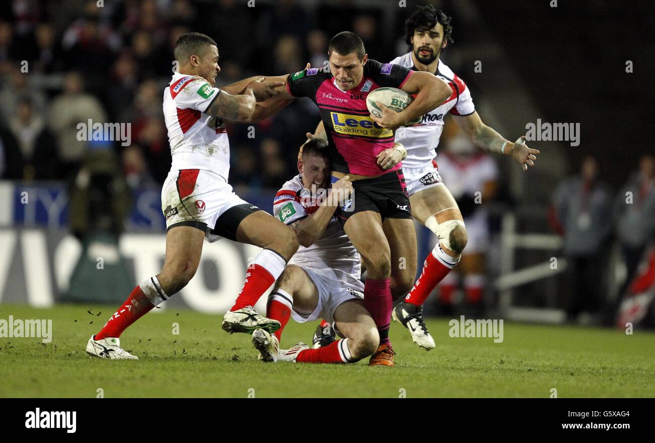 Leed Rhion's Ryan Hall is stopped by St Helen's Jordan Turner, Gary ...