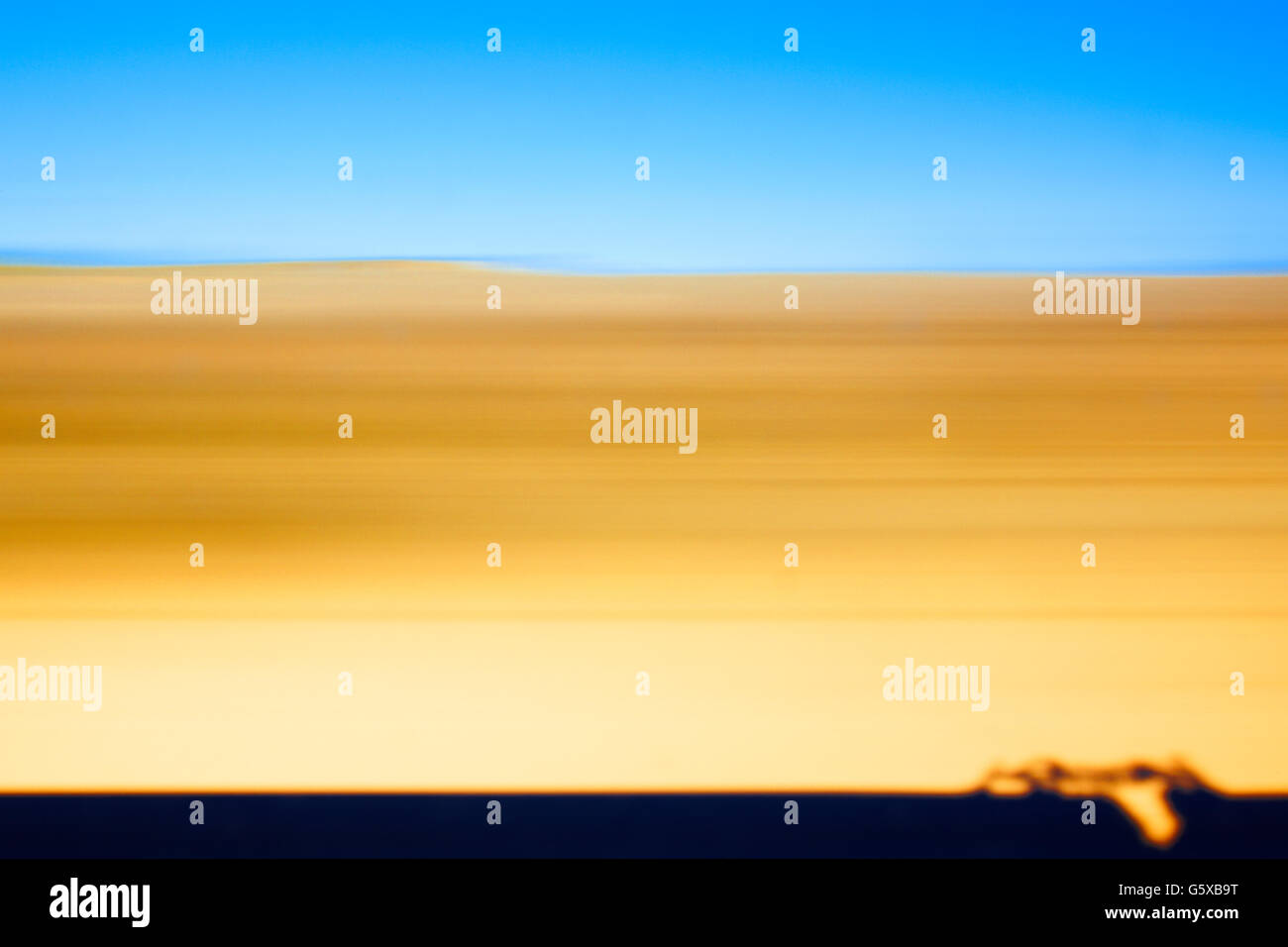 Yellow and blue landscape view from a train. Horizontal format Stock ...