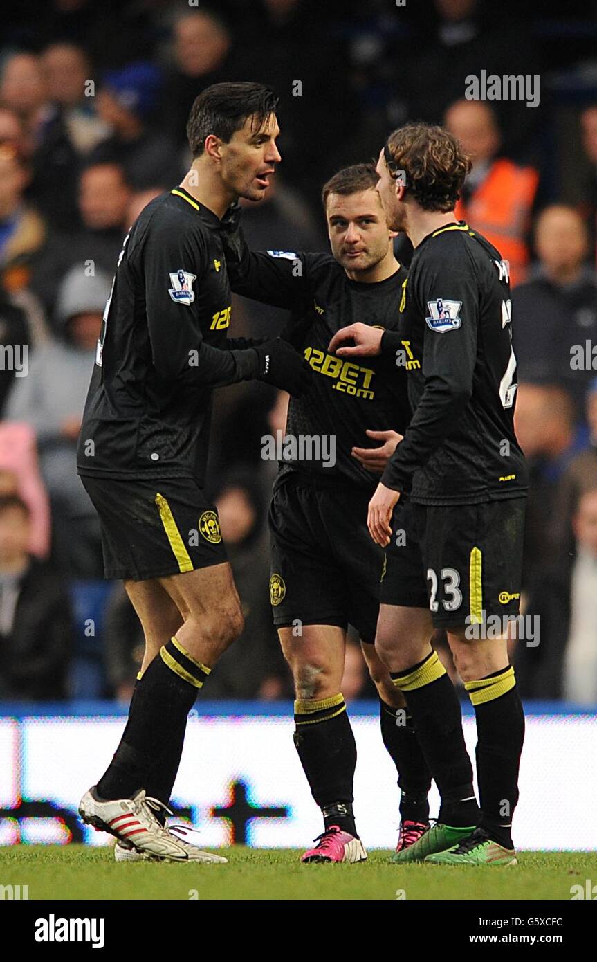 Wigan Athletic's Shaun Maloney (centre) celebrates scoring his teams ...