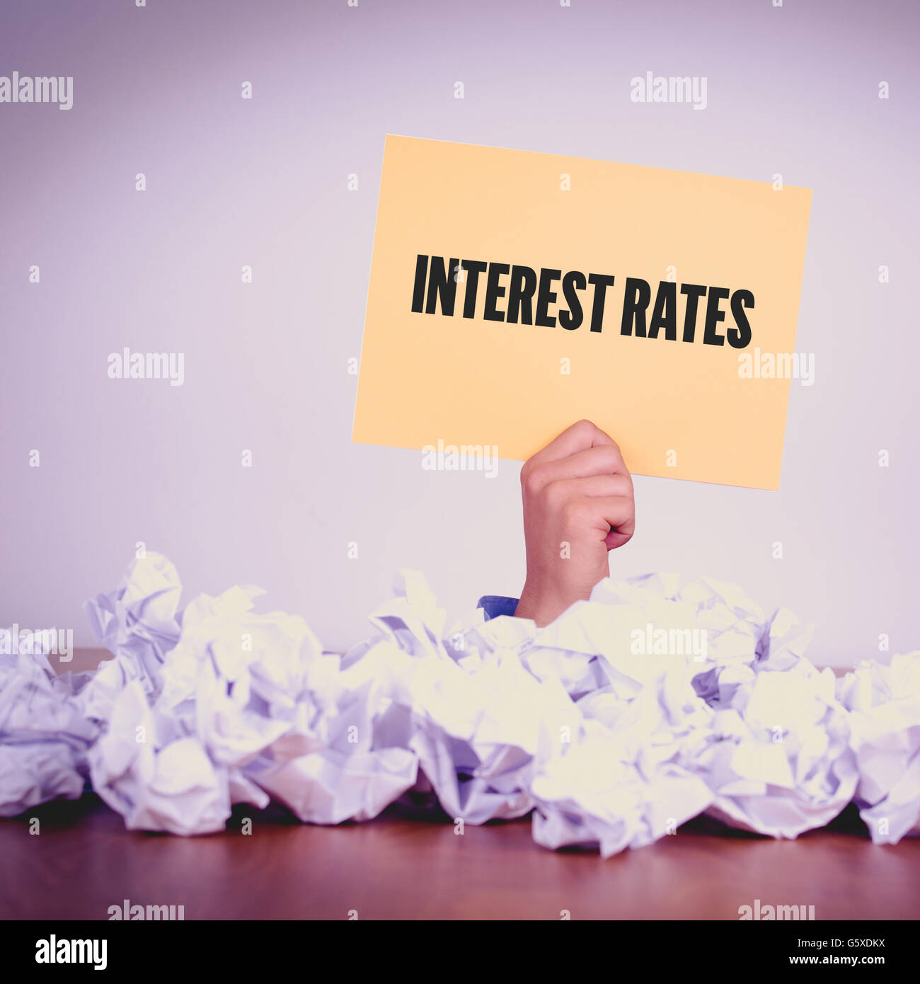 HAND HOLDING YELLOW PAPER WITH INTEREST RATESCONCEPT Stock Photo - Alamy