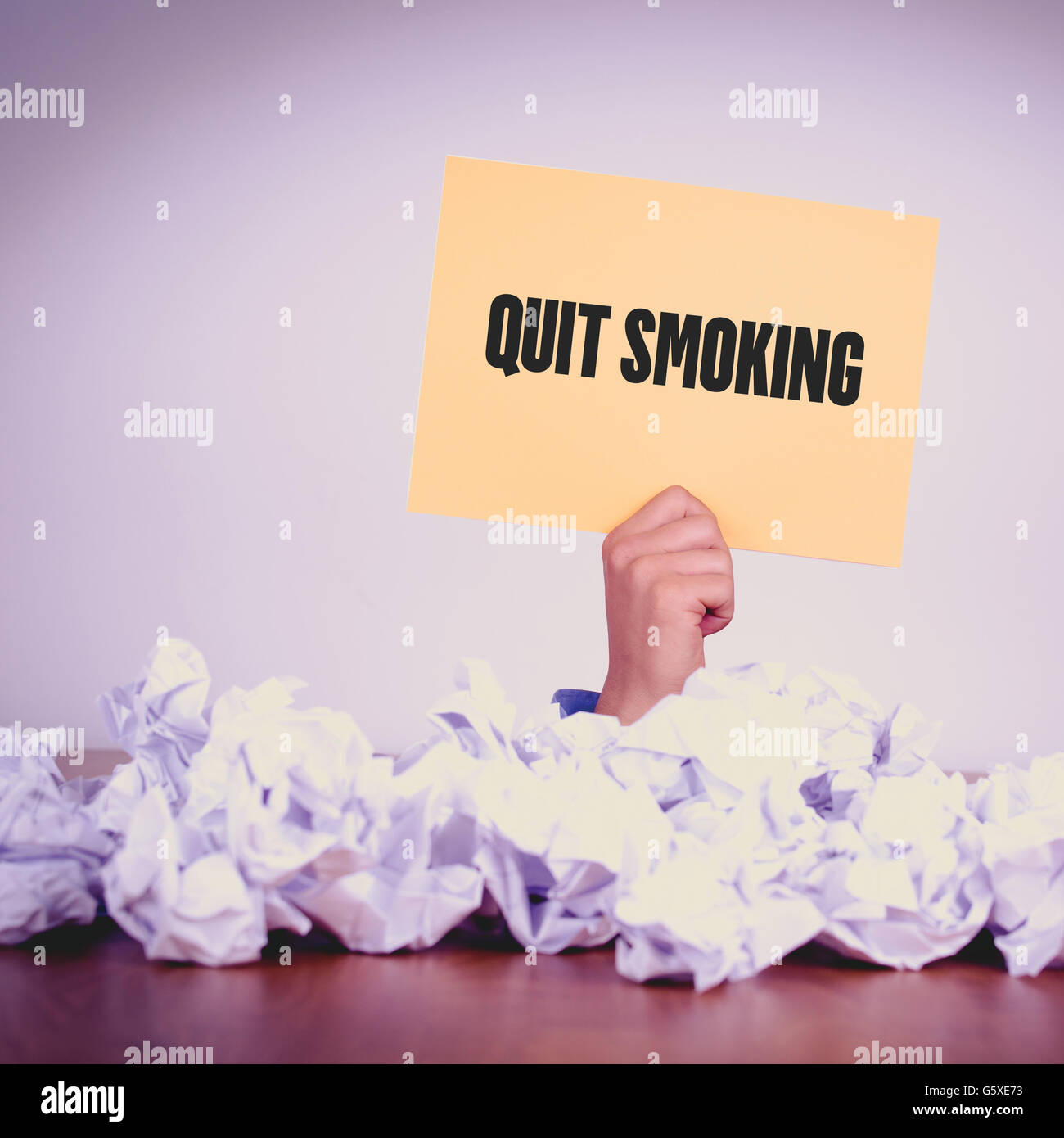 HAND HOLDING YELLOW PAPER WITH QUIT SMOKINGCONCEPT Stock Photo - Alamy
