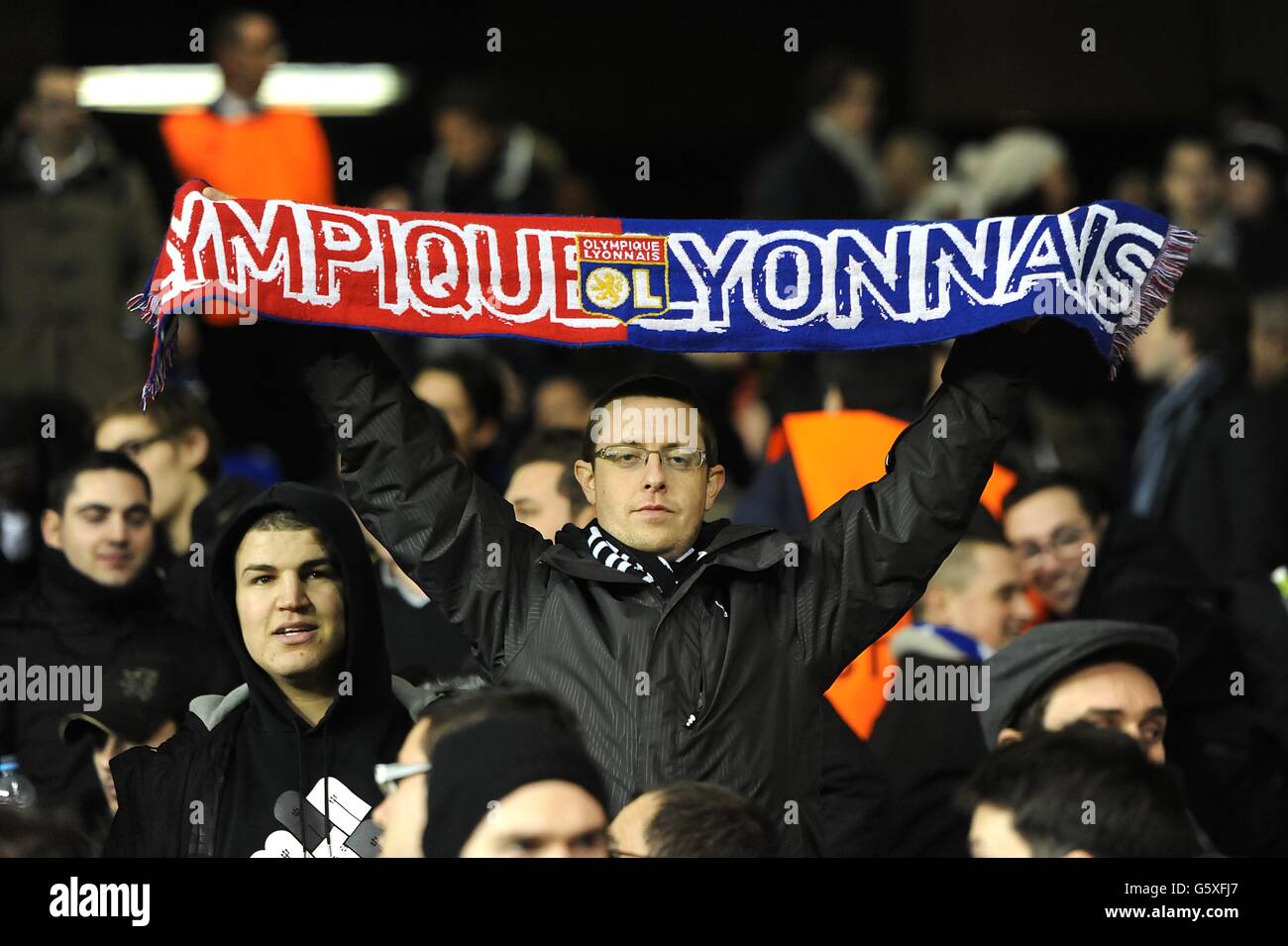Lyon fan on his side in the with scarf hi-res stock photography and ...