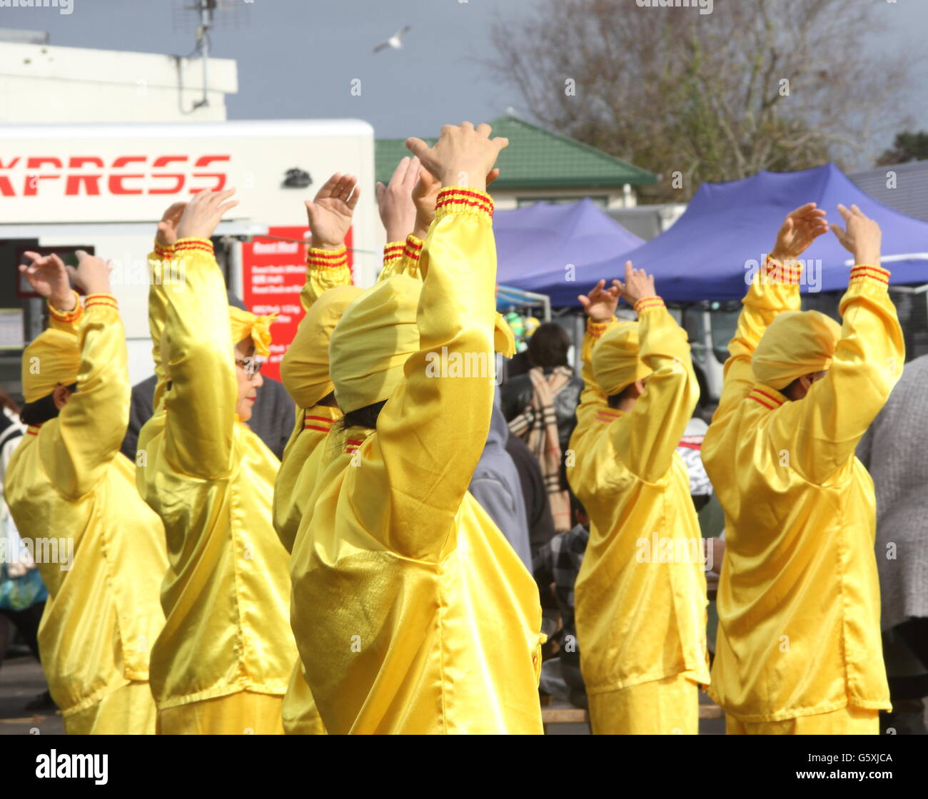 Group performing exercises at Avondale Sunday Market, Auckland, New ...
