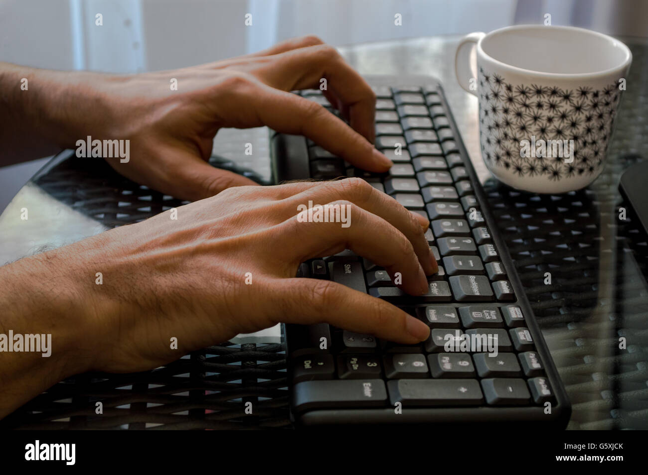 Mans hands holding typing on hi-res stock photography and images - Alamy