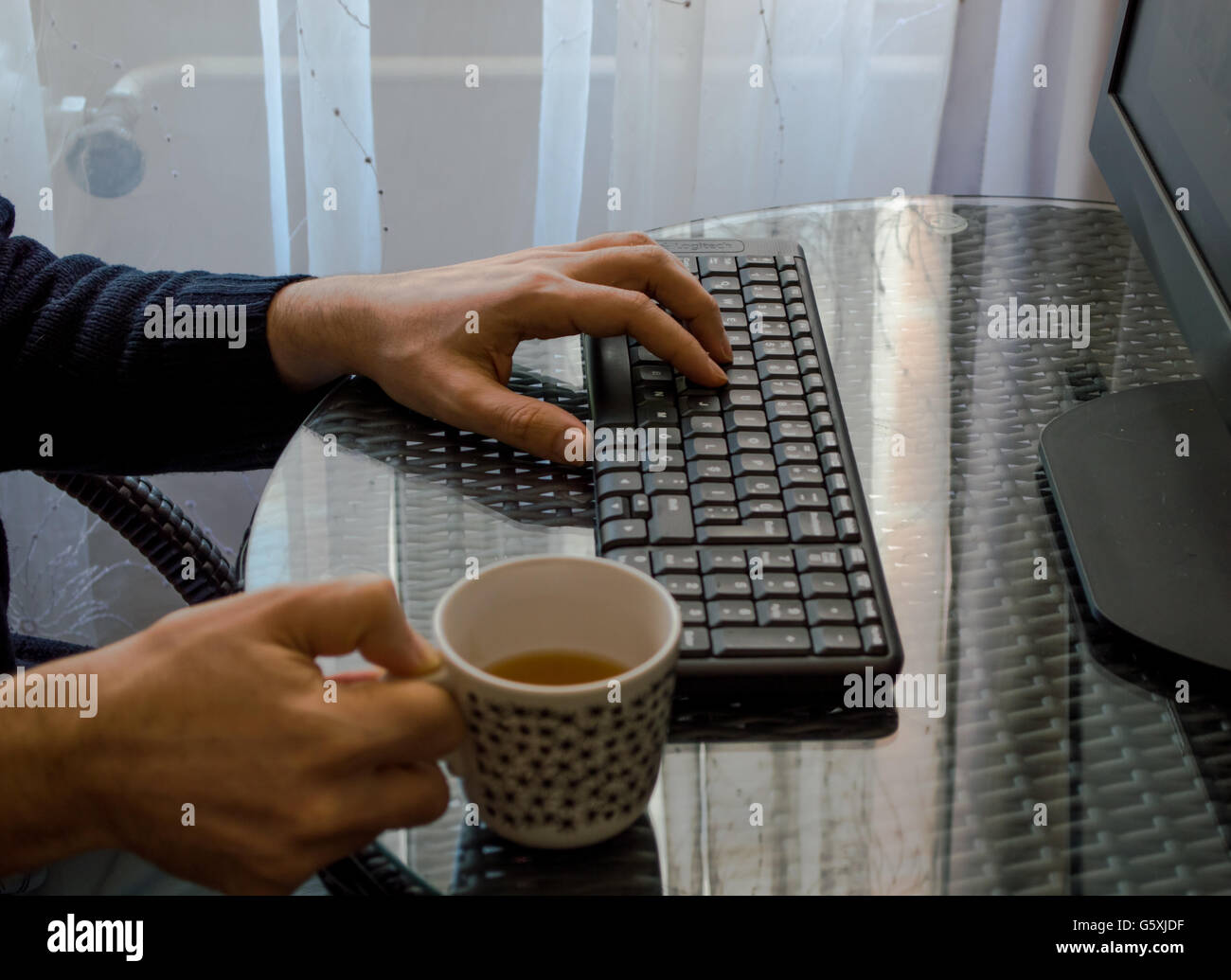 Mans hands holding typing on hi-res stock photography and images - Alamy