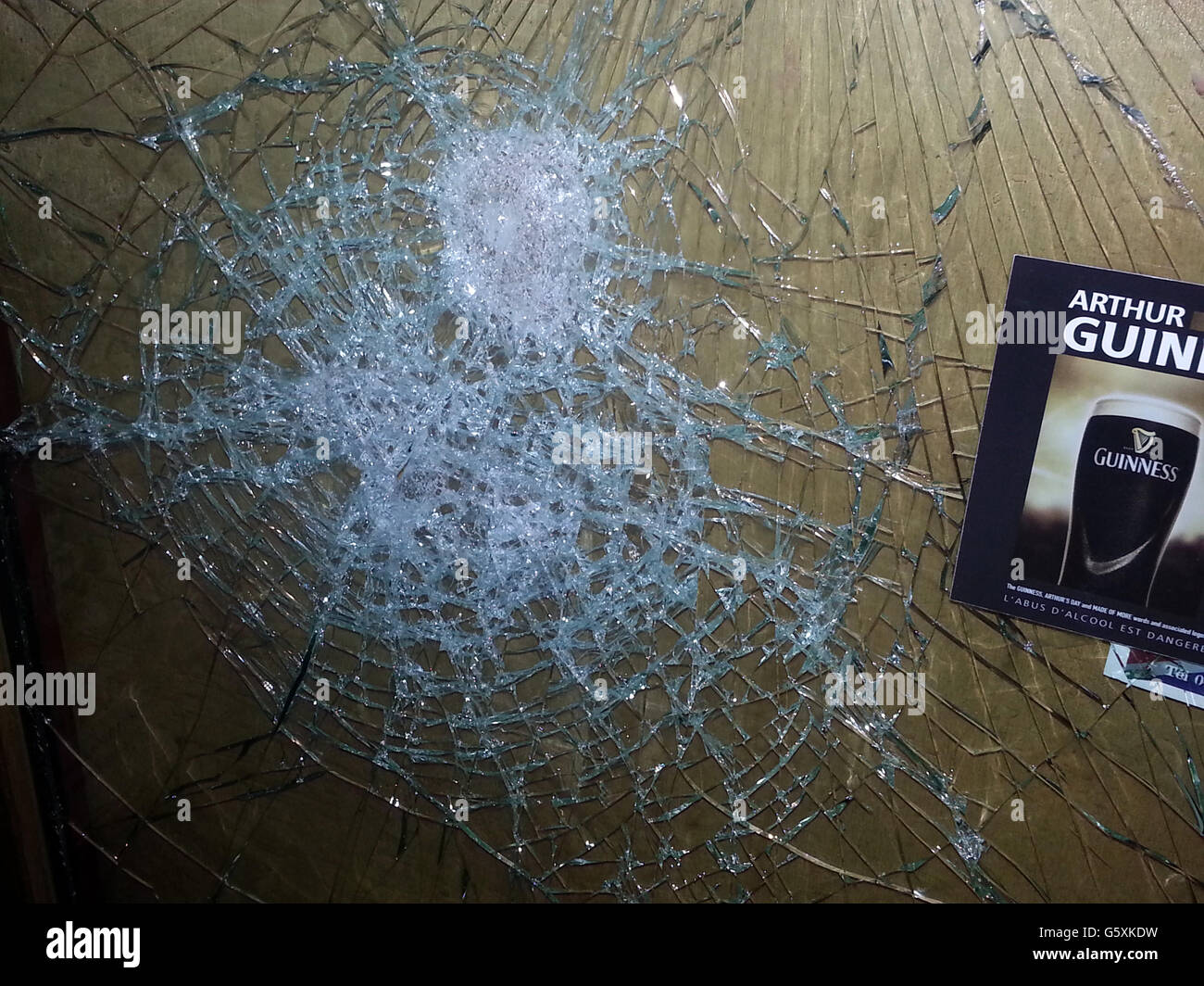 A general view of smashed glass at the Smoking Dog pub in Lyon, where a ...