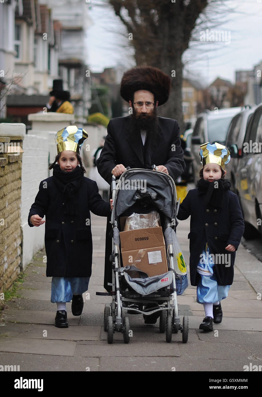Orthodox Jewish children celebrate the festival of Purim in the streets ...