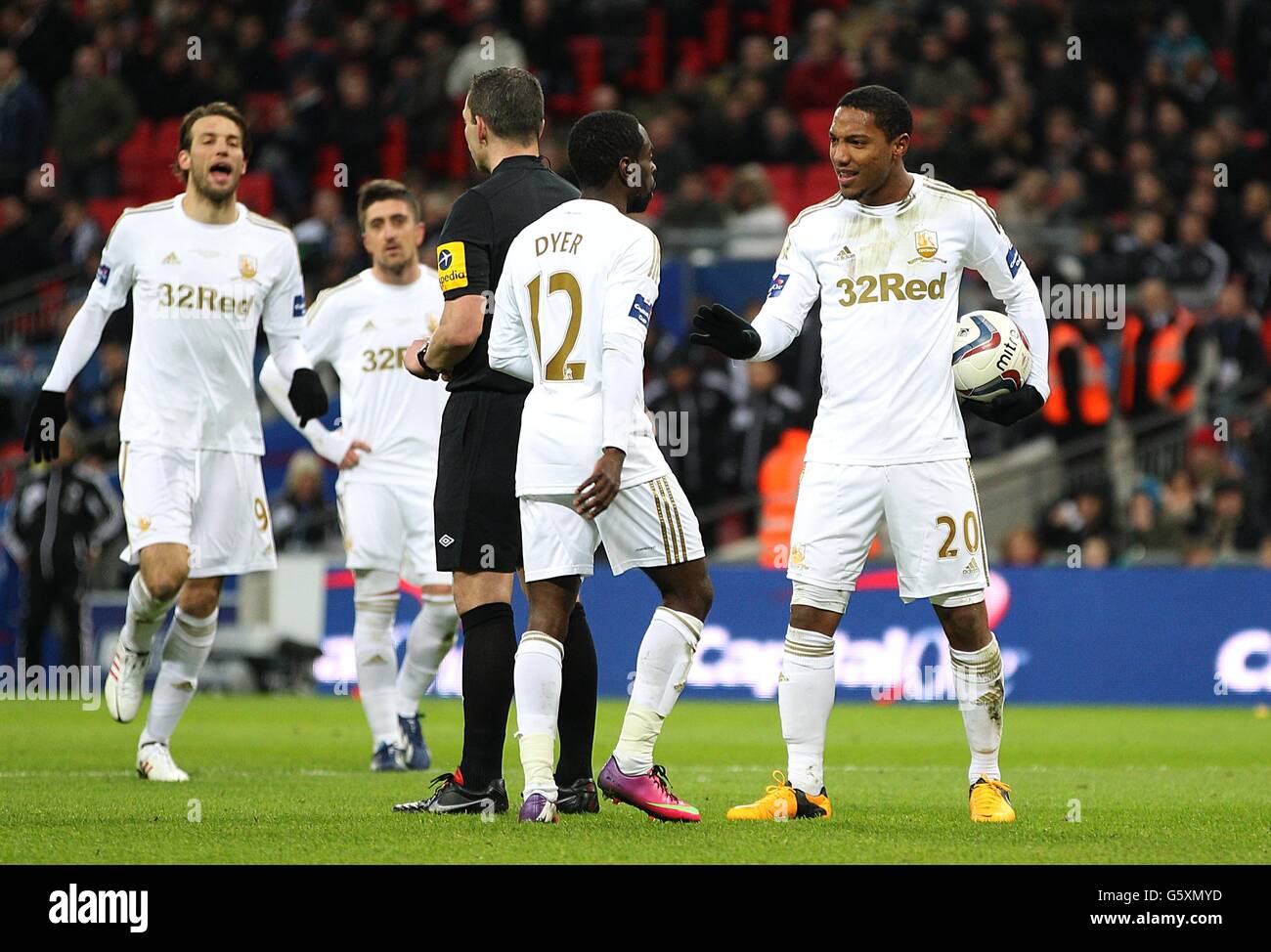 Swansea City's Jonathan de Guzman (right) and Nathan Dyer argue over ...
