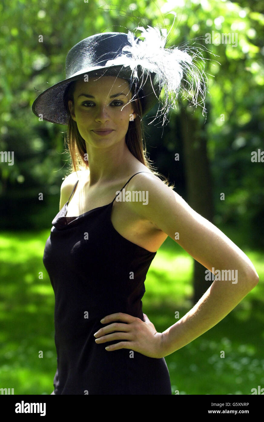 1 2 half length hat hand on hip feathers hi-res stock photography and ...
