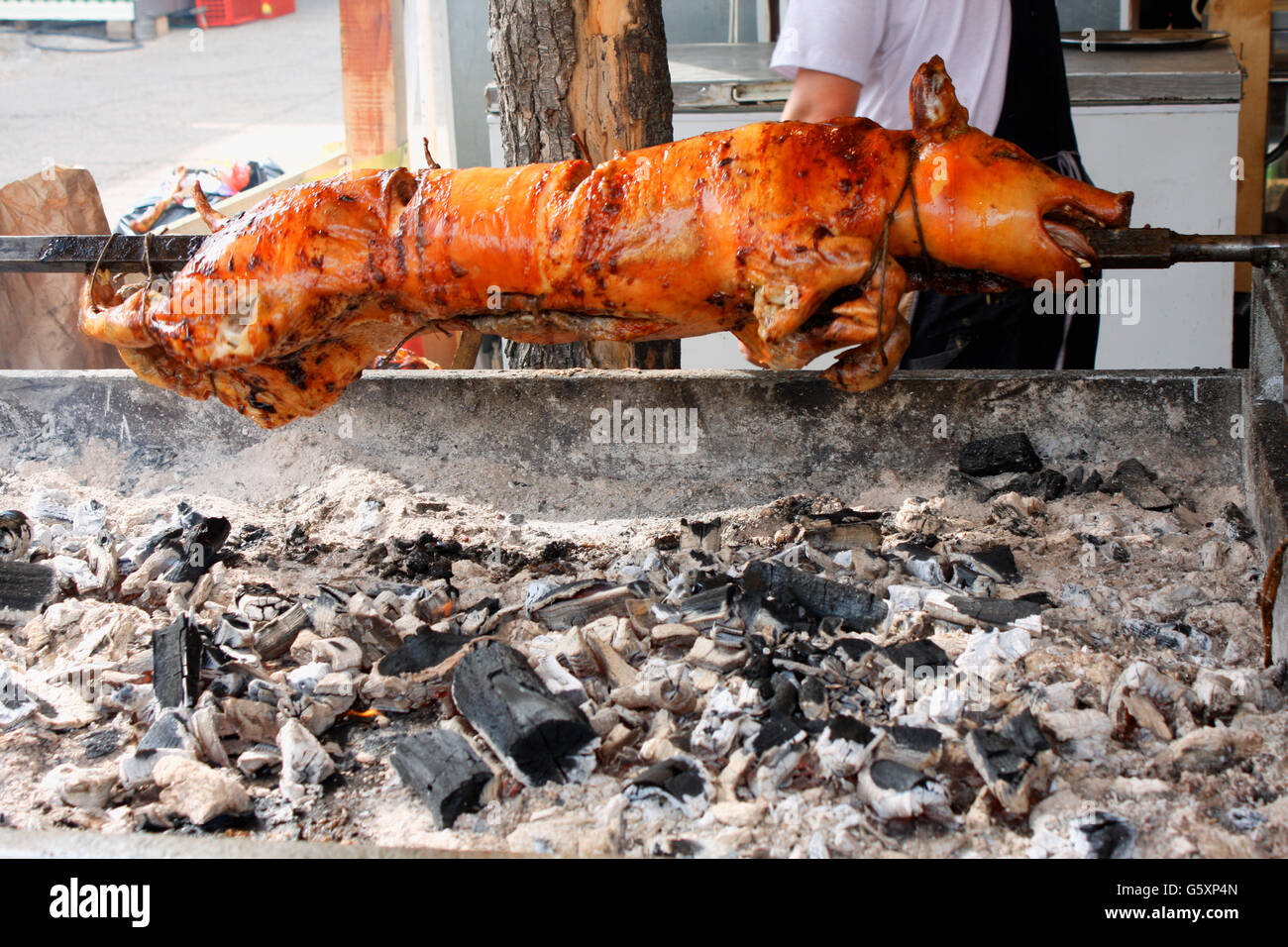 huge grilled pork fact, medieval fair Stock Photo - Alamy