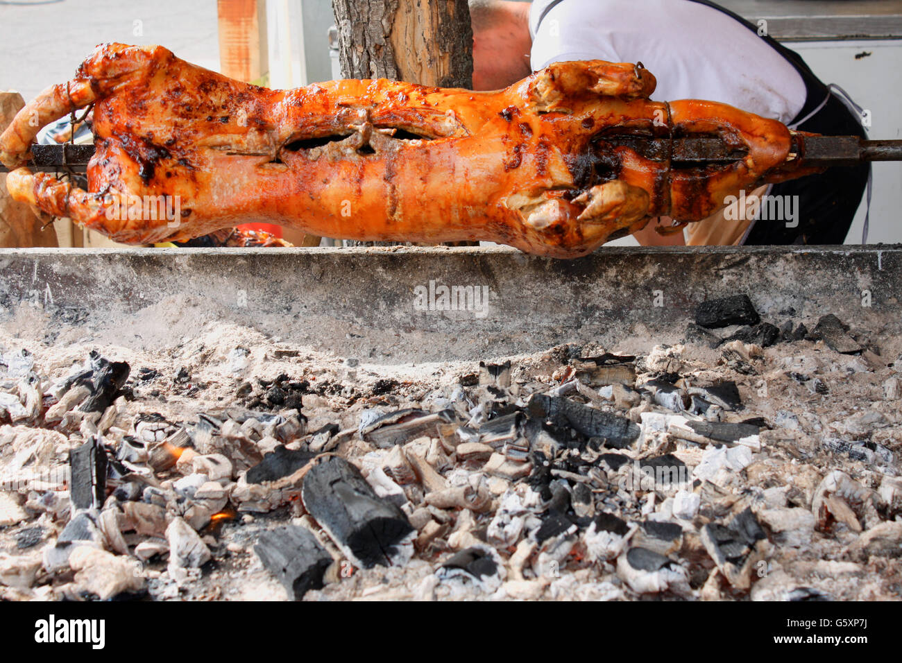 huge grilled pork on fire Stock Photo - Alamy