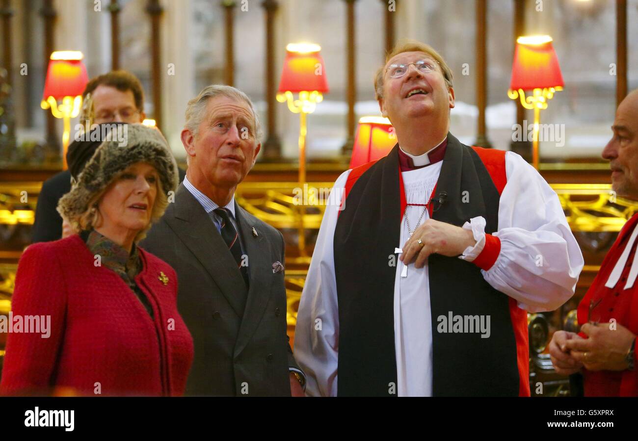 The Prince of Wales and The Duchess of Cornwall look at the roof of the ...