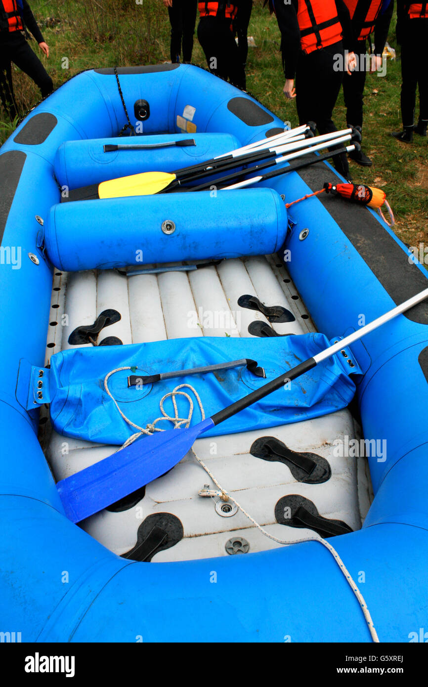 rafting inflatable blue boat wit rafters on side Stock Photo - Alamy