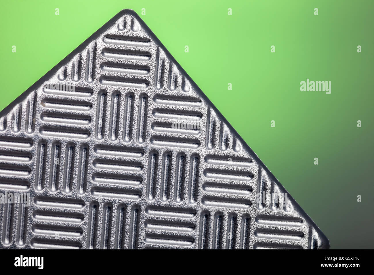 Composition of a plaque of metal as a triangle shape Stock Photo - Alamy