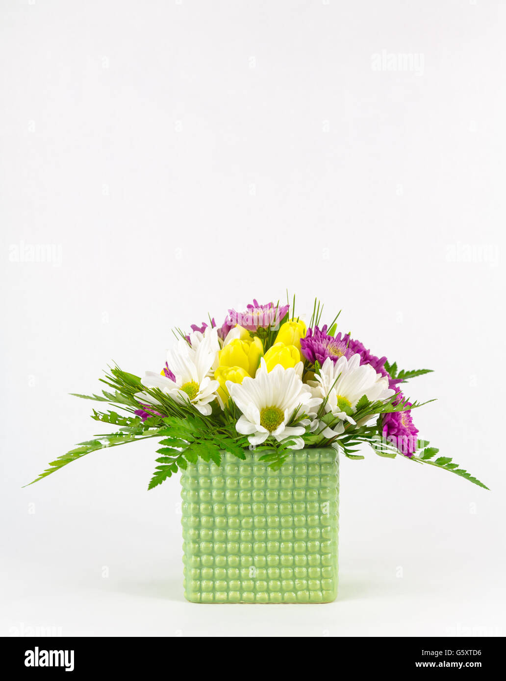 Fresh spring bouquet in glass vase in portrait orientation with copy ...