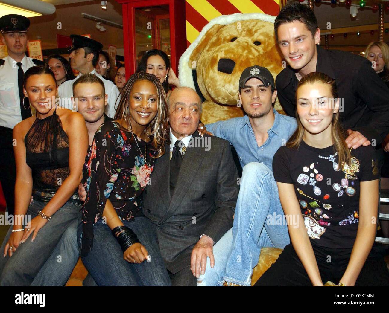 Harrods Chairman Mohamed Al Fayed (centre) with pop band Liberty X and ...