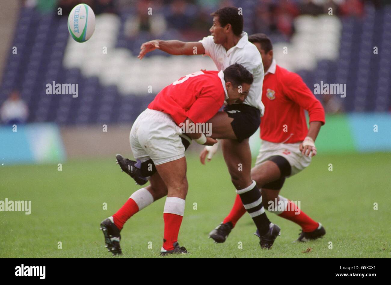 RUGBY WORLD CUP SEVENS. TONGA (IN RED) ACTION Stock Photo - Alamy