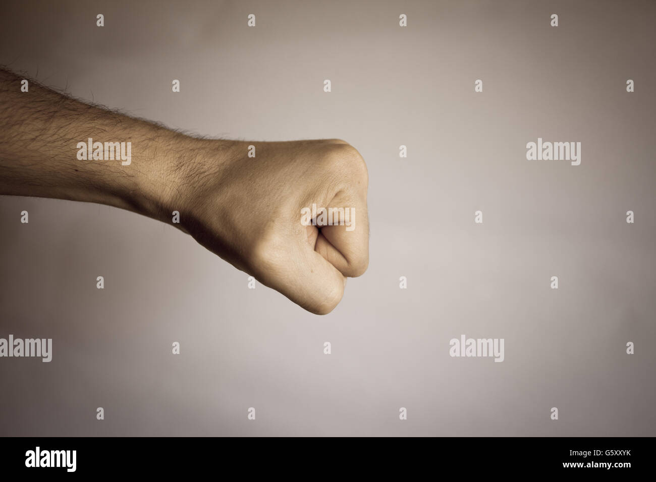 Human hand on vintage background to express strength Stock Photo - Alamy