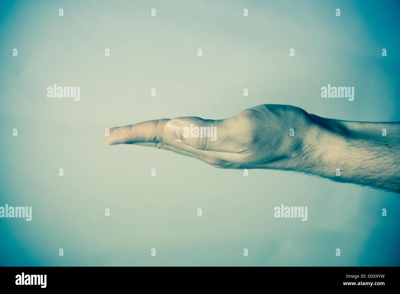 Human hand on vintage background Stock Photo - Alamy
