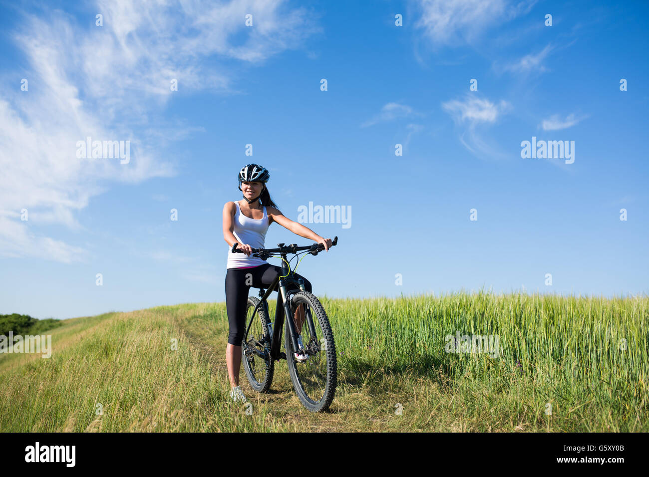 girl rides a bicycle in the countryside Stock Photo - Alamy
