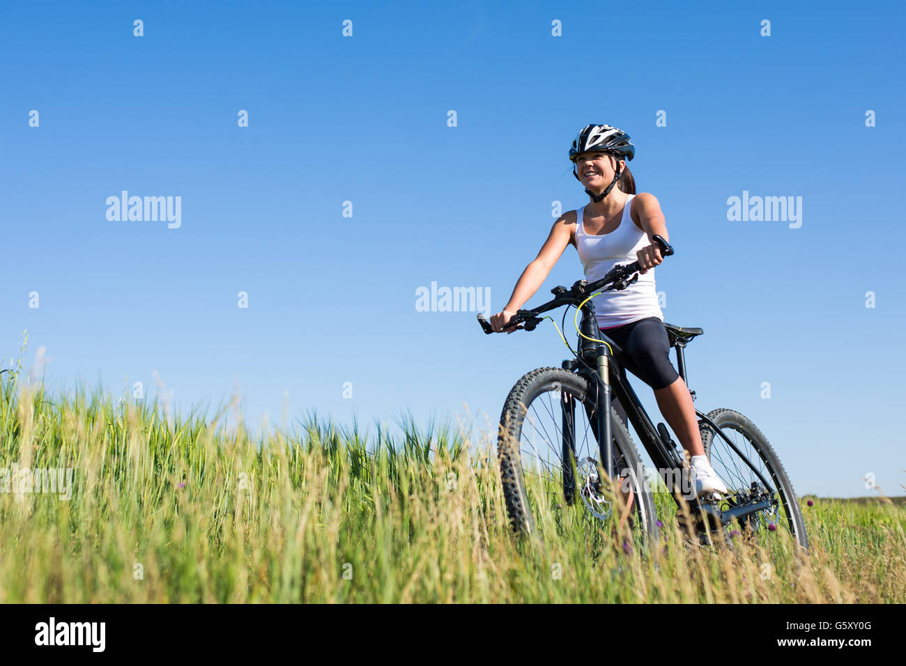 girl rides a bicycle in the countryside Stock Photo - Alamy