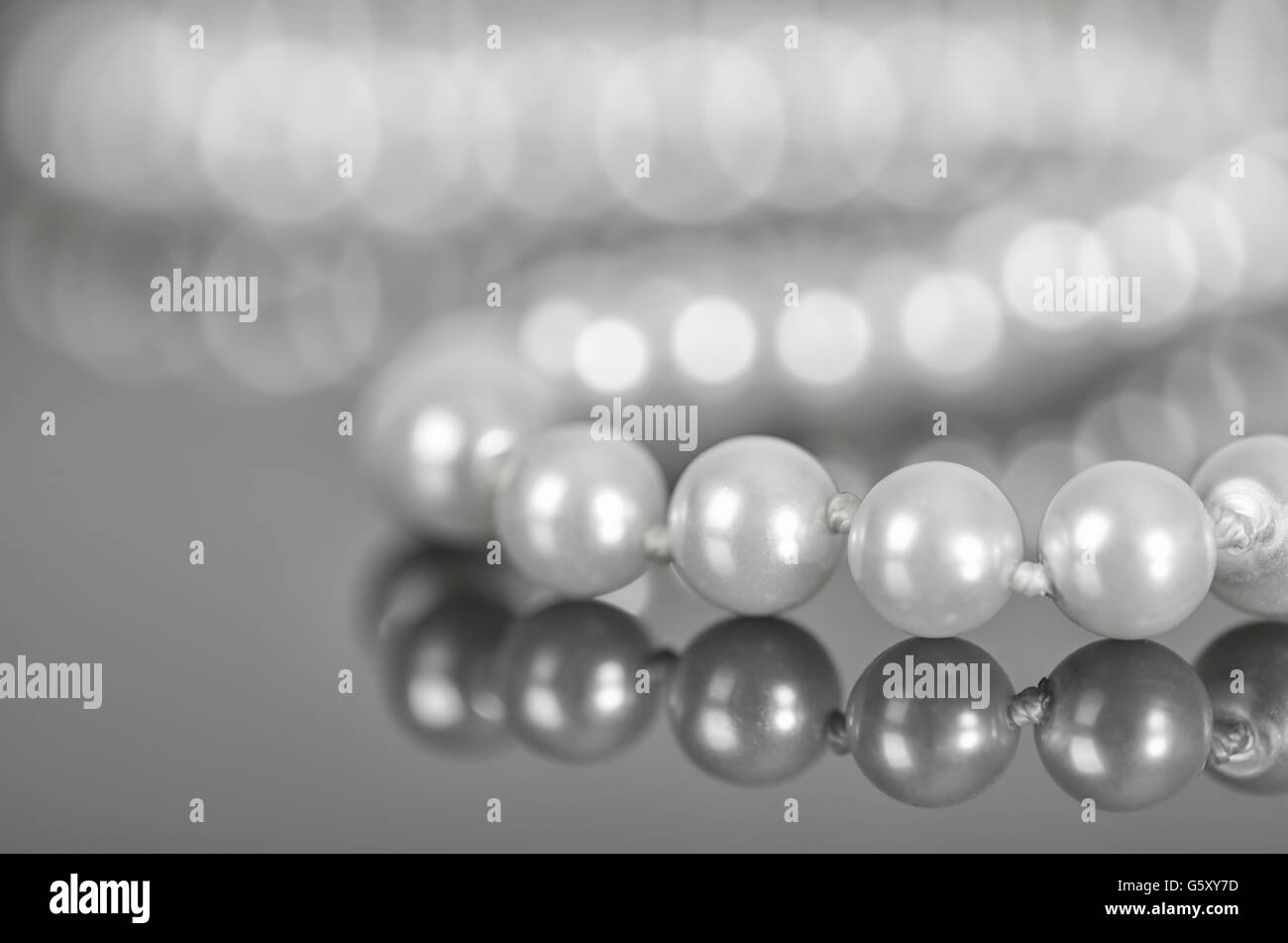 Pearl necklace on a black background Stock Photo - Alamy