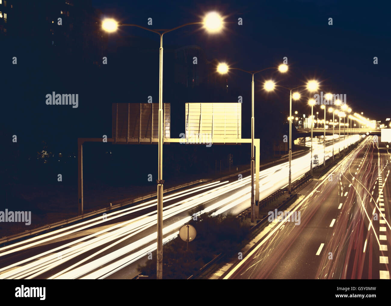 Highway at night with flares and lights Stock Photo - Alamy