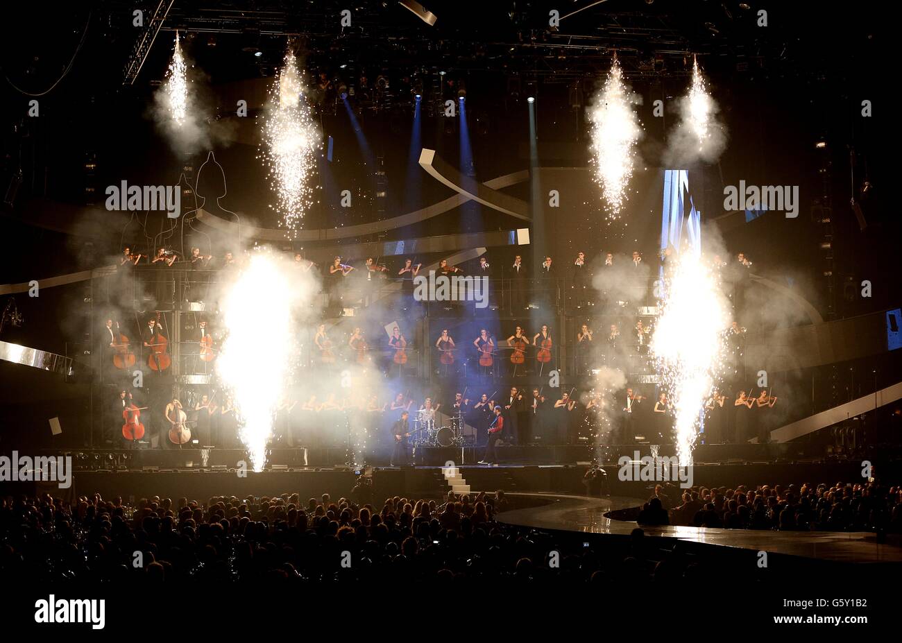 Muse perform during the 2013 Brit Awards at the O2 Arena, London Stock ...