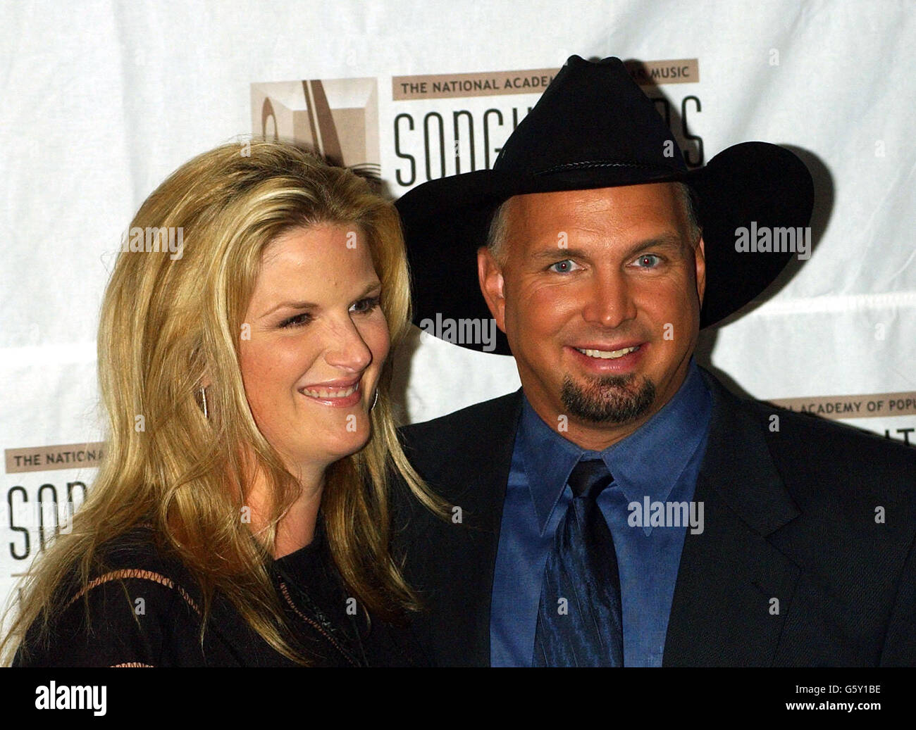 American country music singers Trisha Yearwood and Garth Brooks pose ...