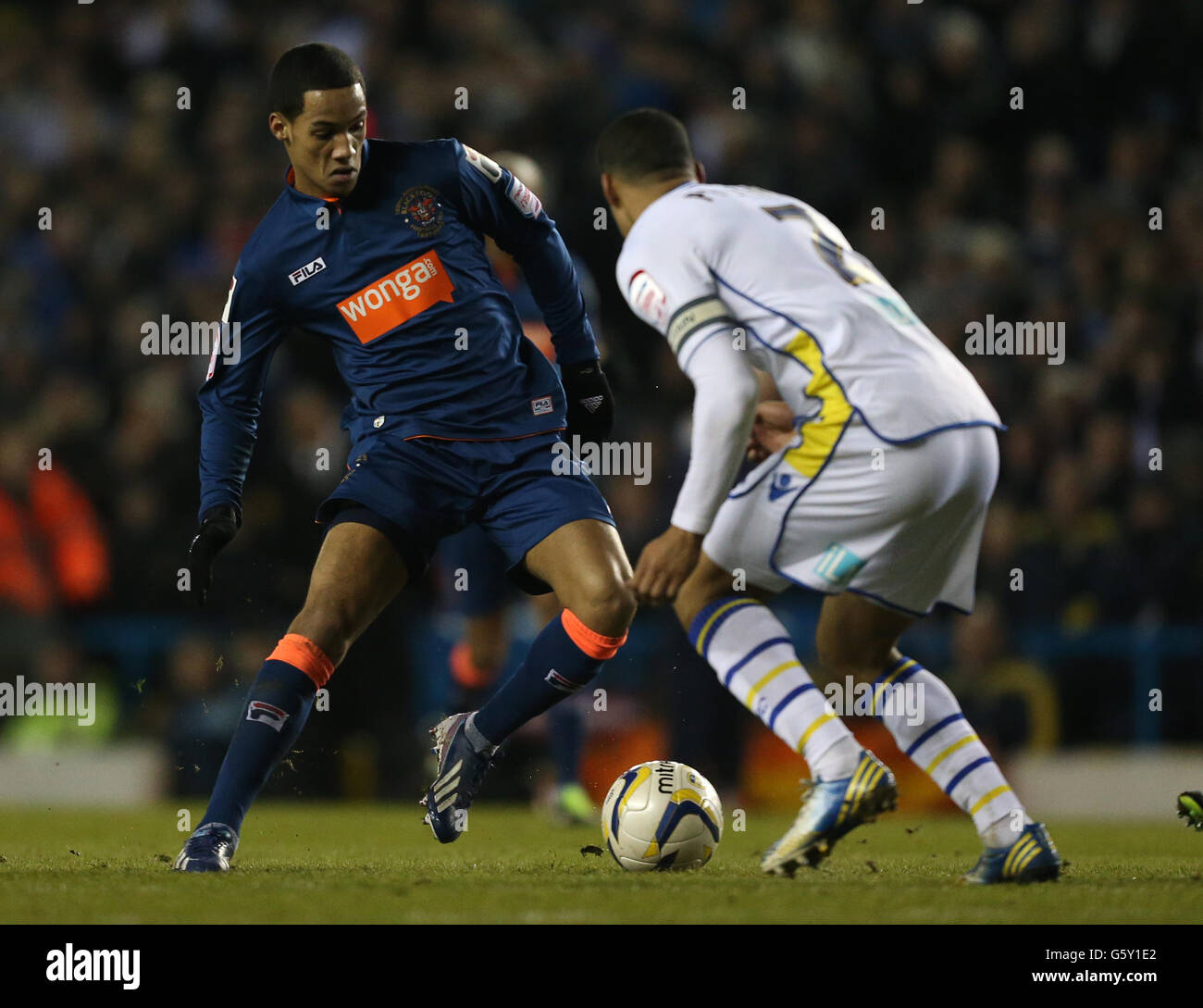 Leeds United's Lee Peltier and and Blackpool's Thomas Ince (left Stock ...