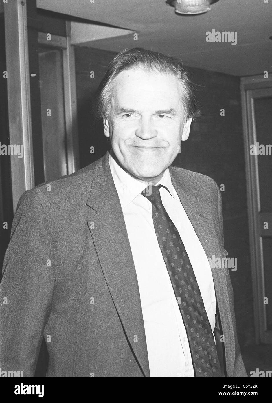 Sir Robert Armstrong arriving at Heathrow Airport from Australia after ...