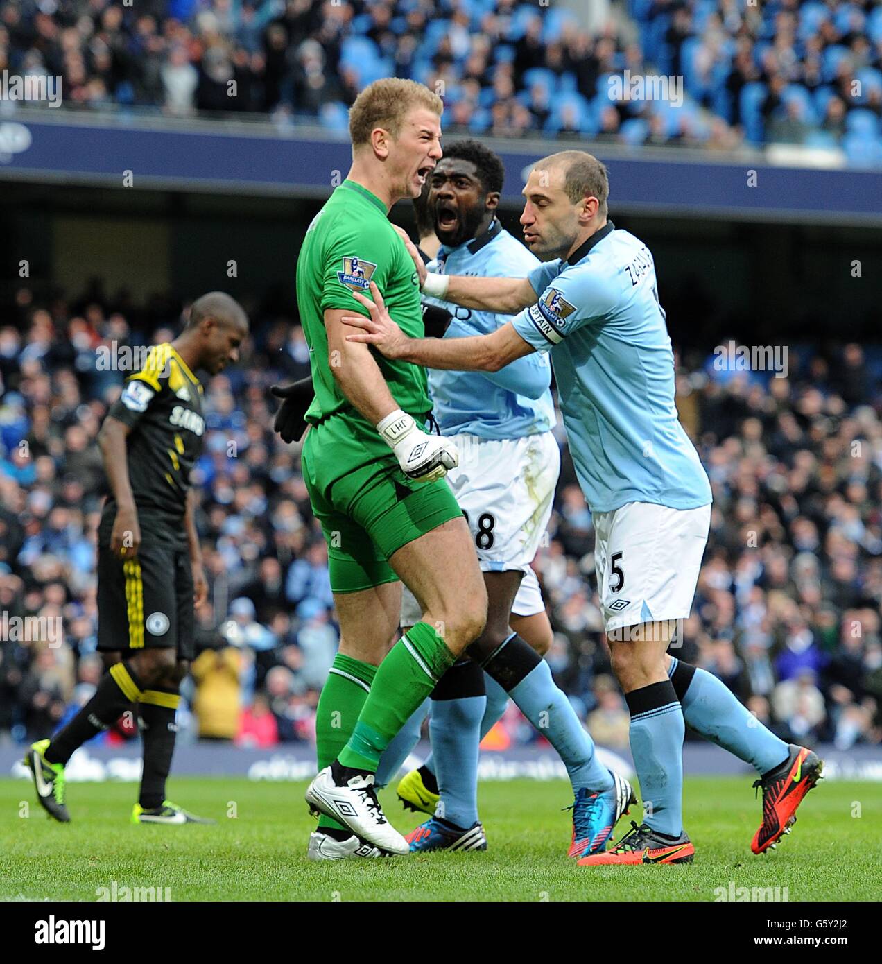 Manchester City's Joe Hart (left) celebrates saving a penalty from ...
