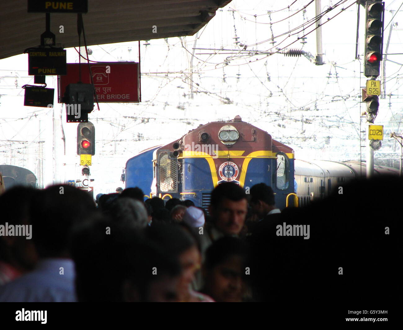 Train arriving at a crowded station in India Stock Photo - Alamy