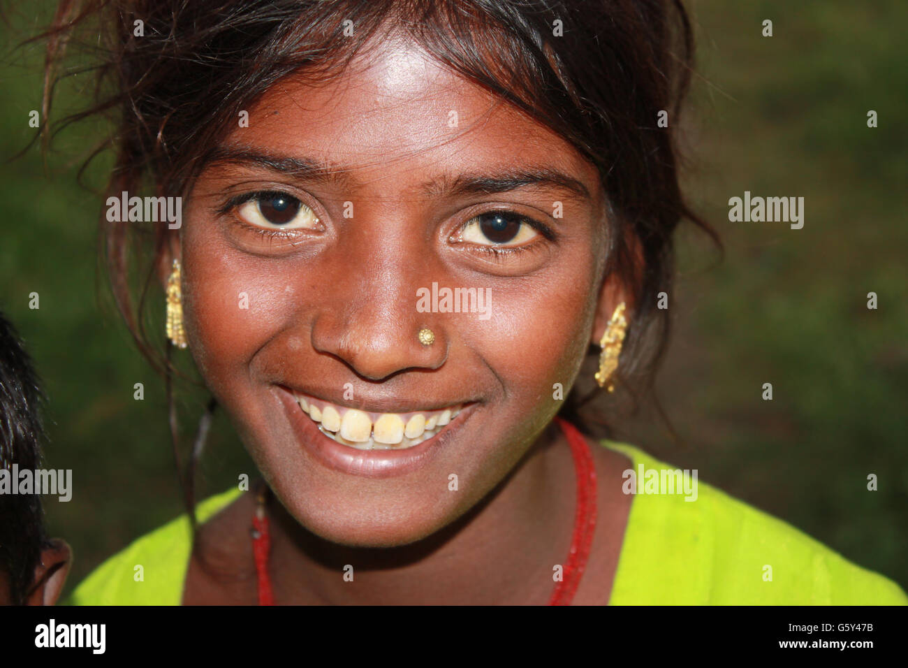 A portrait of a poor Indian girl with a beautiful smile Stock Photo - Alamy