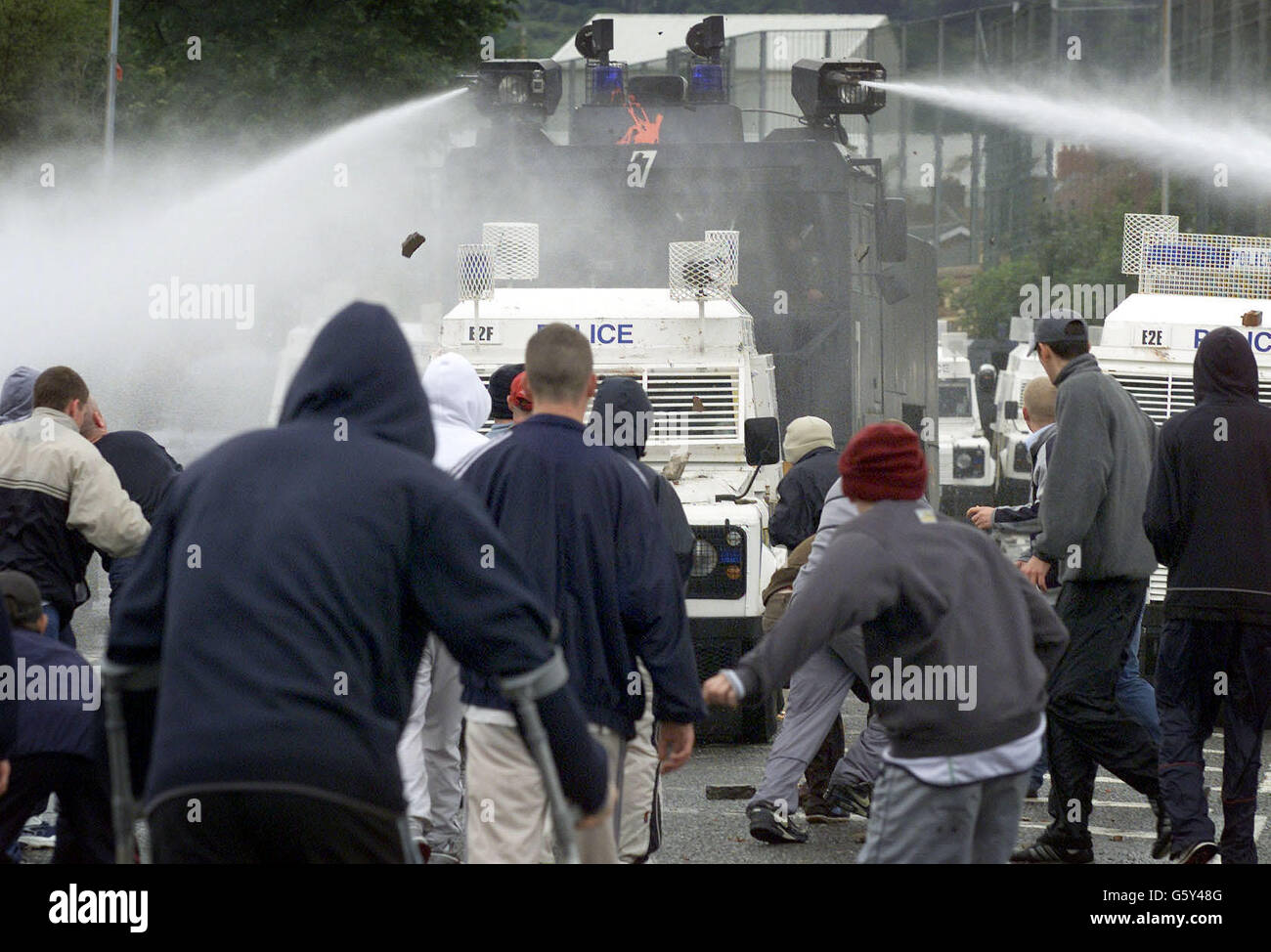 Police using a water cannon to disperse nationalists Stock Photo - Alamy