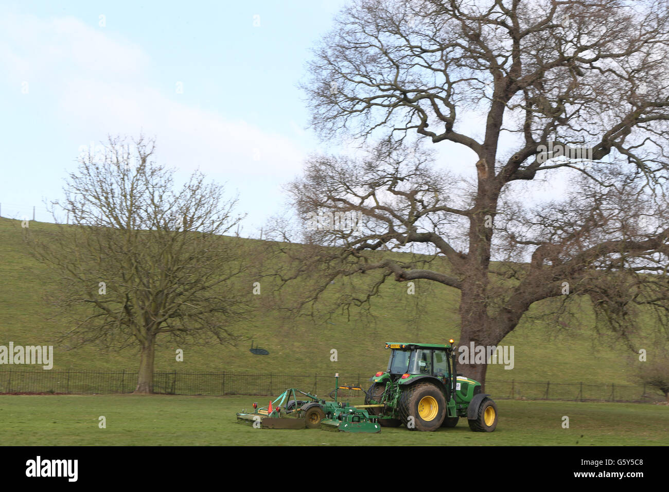 Tractor cutting grass Stock Photo - Alamy