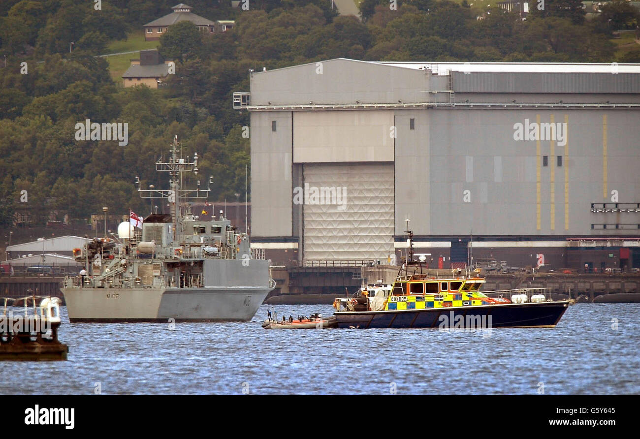 A patrol boat sits in the water outside Faslane Naval Base on the Clyde ...