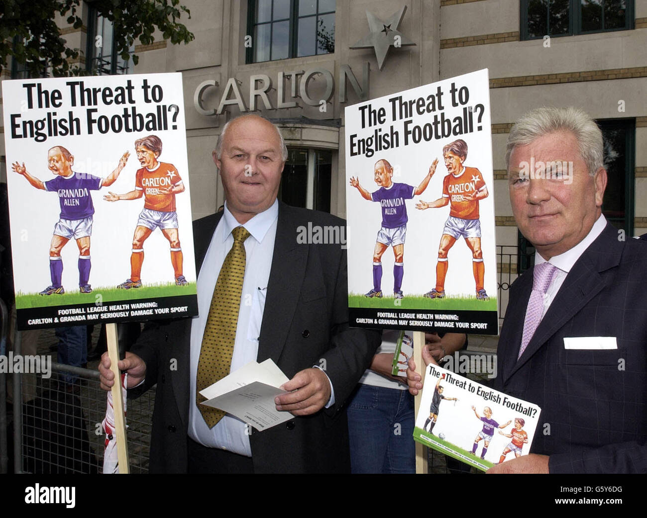 Terry Robinson of Sheffield United (left) stands shoulder to shoulder ...