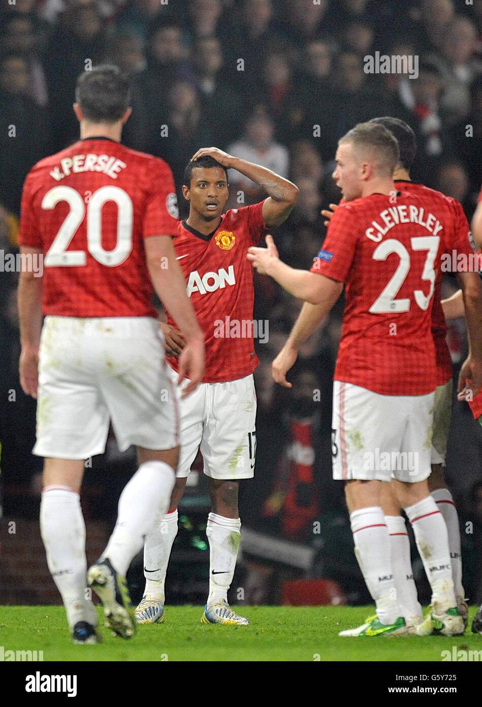 Manchester United's Luis Nani (centre) looks shocked as he is issued a ...