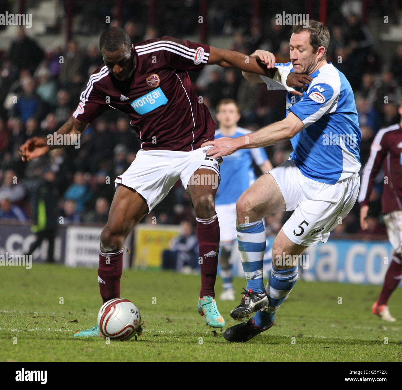 Hearts Michael Ngoo holds off St Johnstone's Frazer Wright (right ...