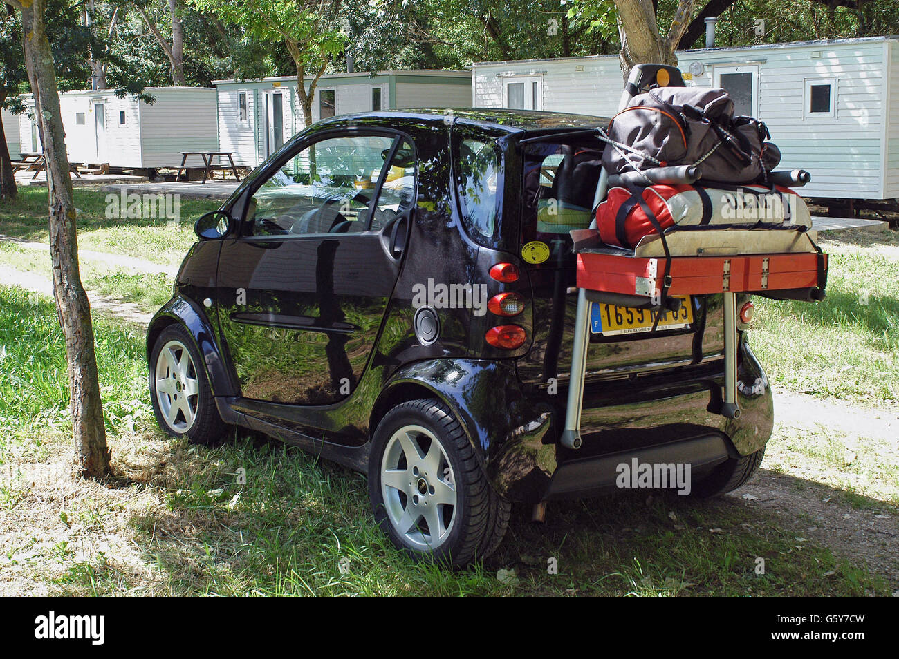 Loading luggage small car hi-res stock photography and images - Alamy