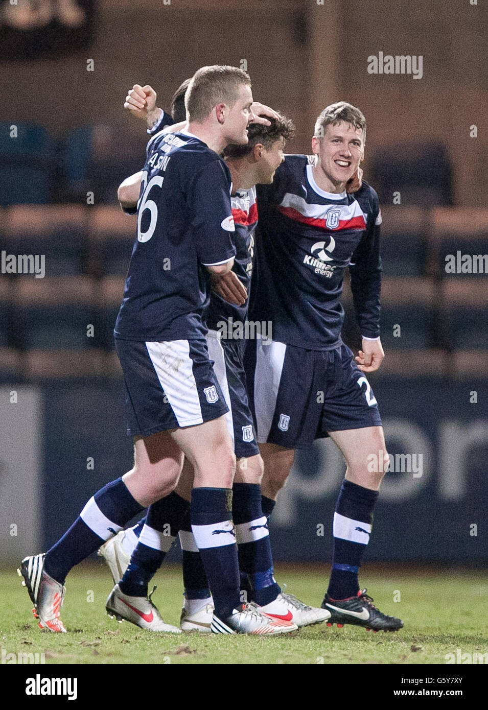 Dundee's Jim McAlister (right) celebrates with Nicky Riley (centre) and ...
