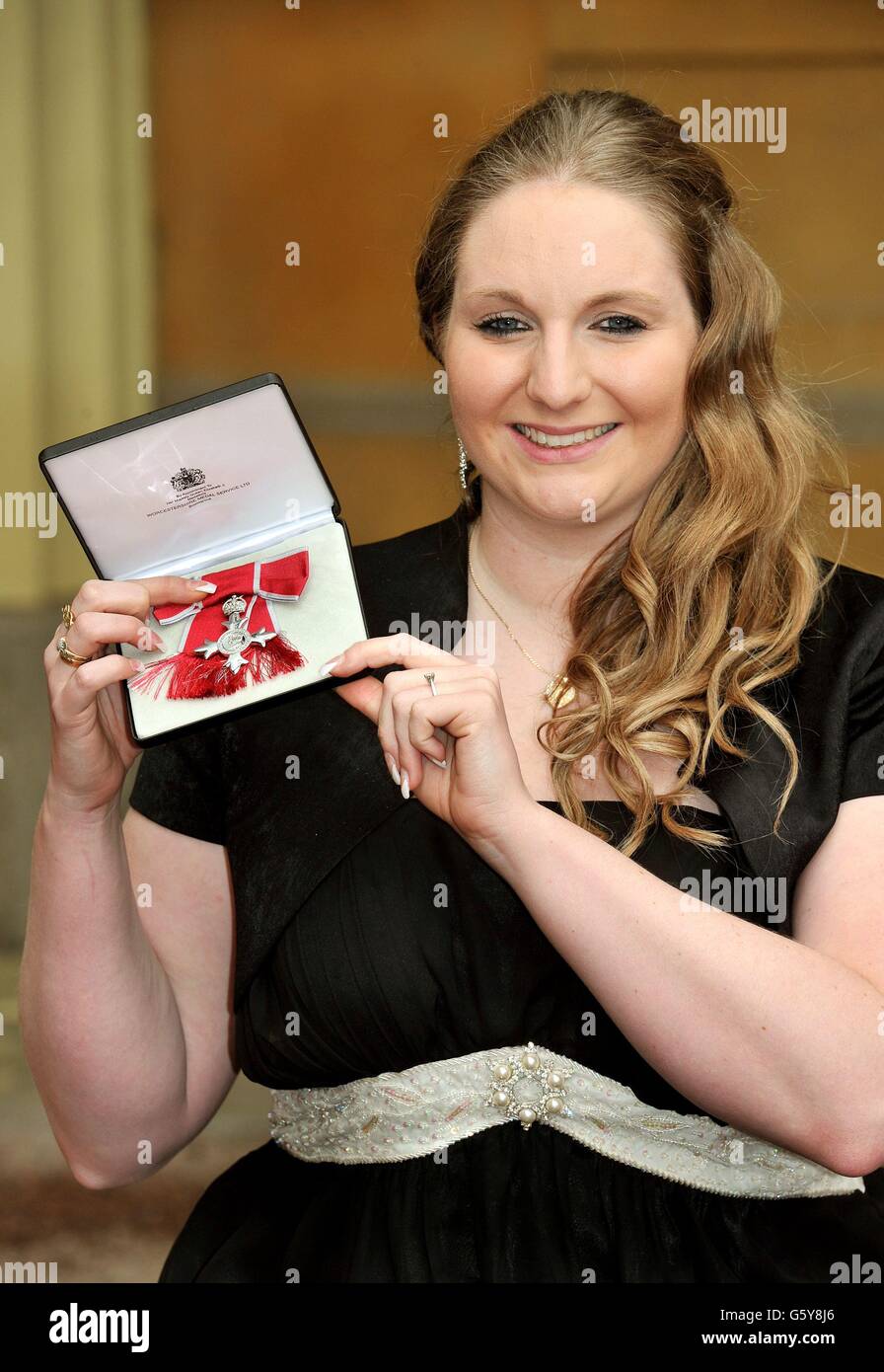 Heather Frederiksen proudly holds her MBE award after the Investiture ...