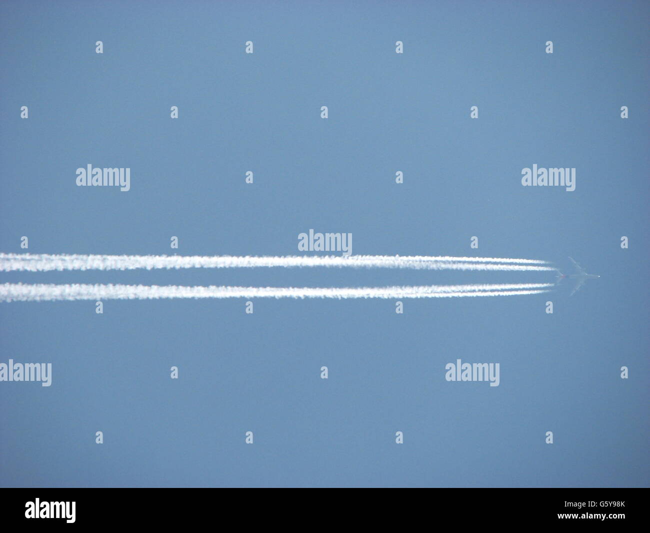 Speeding Jet in the sky Stock Photo - Alamy