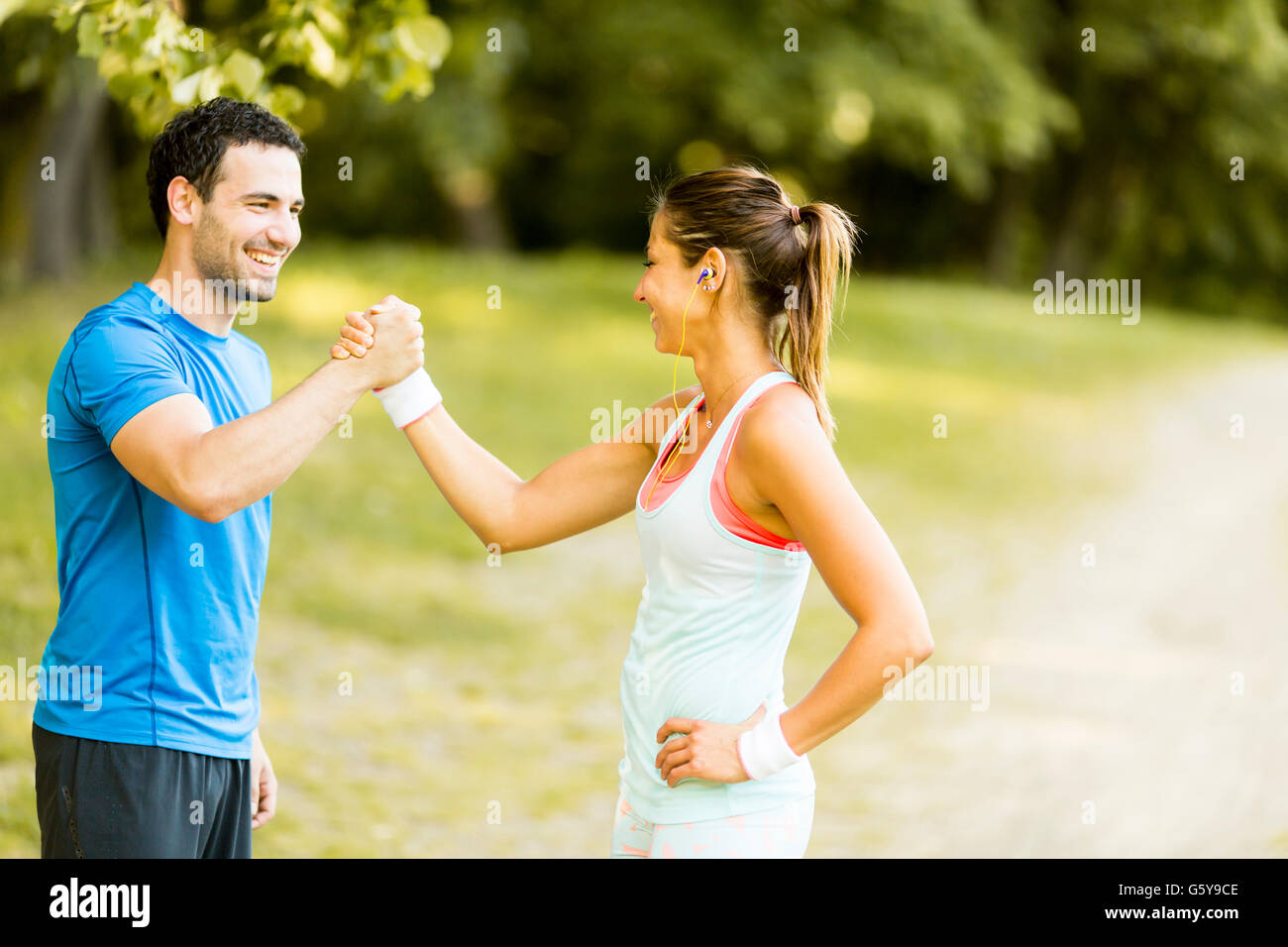 Woman training with personal trainer outdoor Stock Photo - Alamy