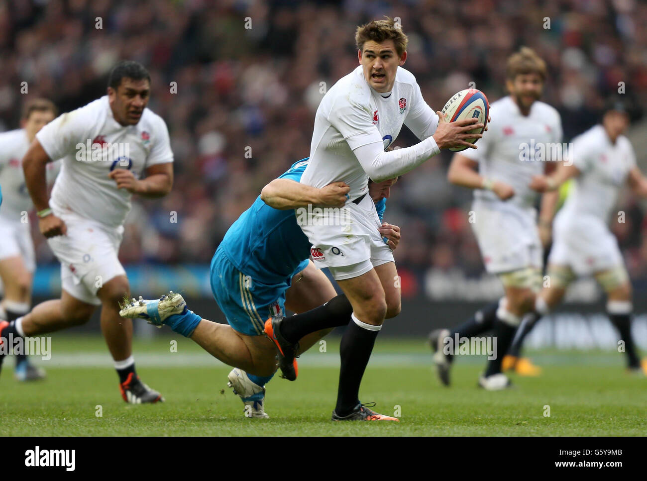 England's Toby Flood is tackled by Italy's Alberto De Marchi during the ...