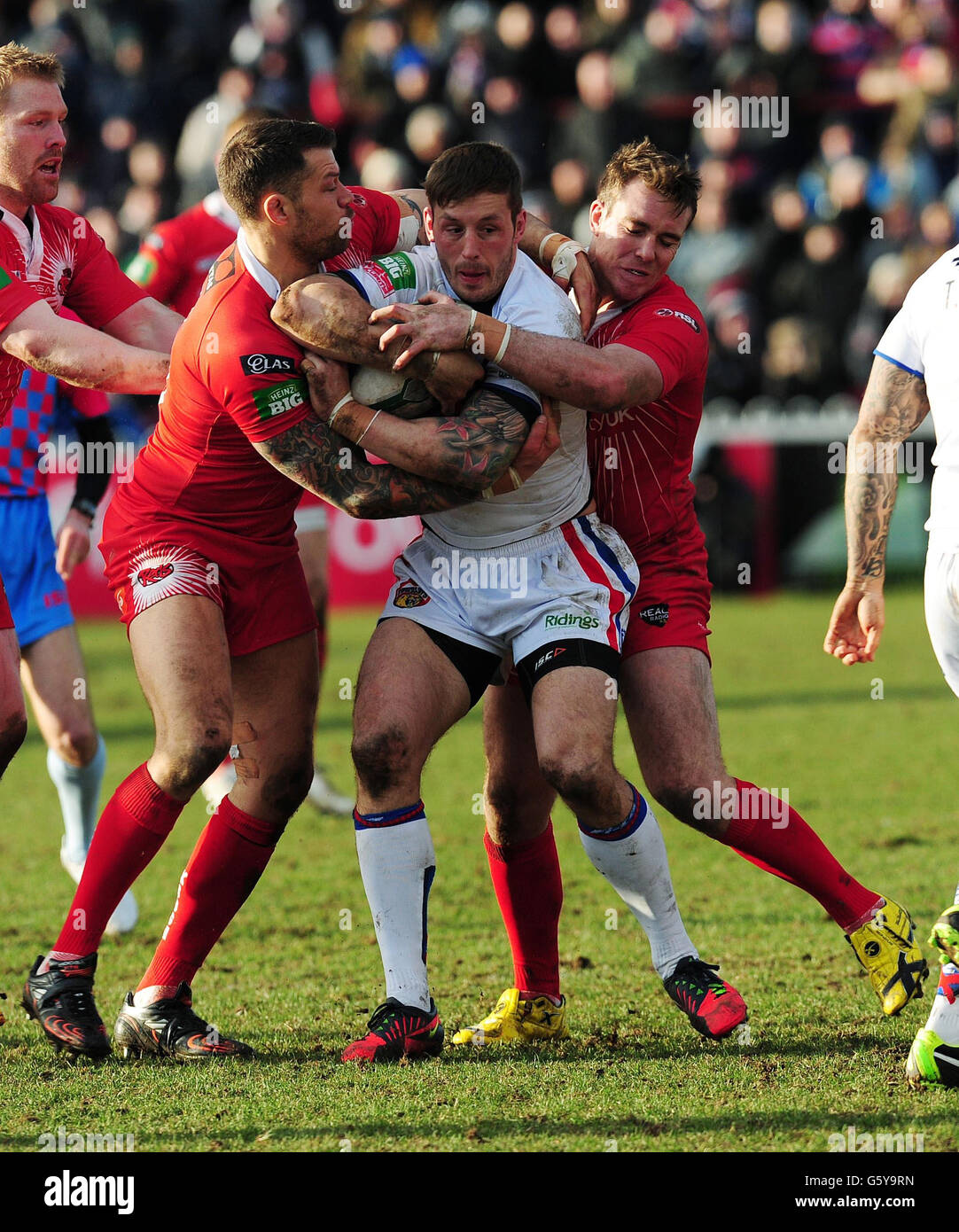 Wakefield Wildcats' Oliver Wilkes is held by the Salford City Reds ...