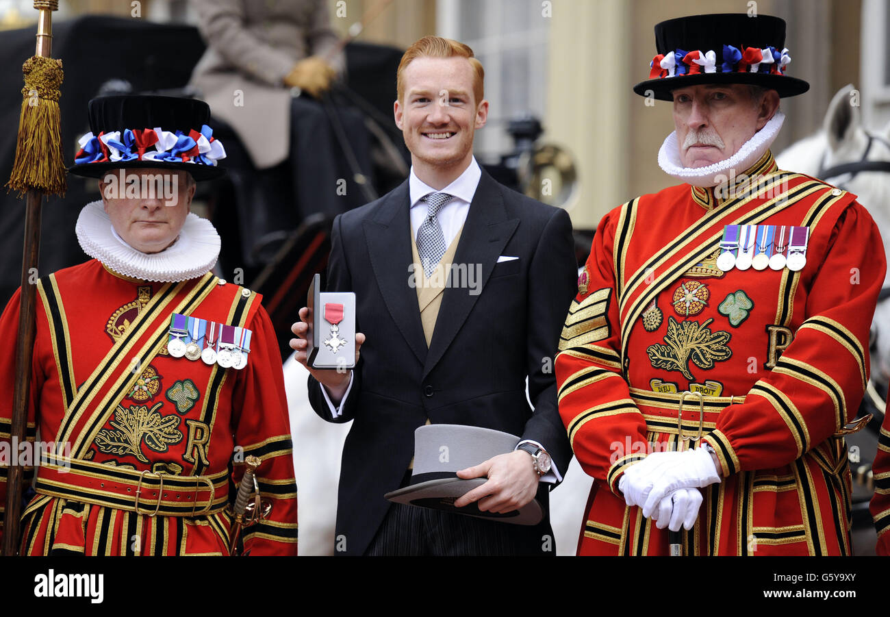 Olympic Gold medal winner Greg Rutherford poses with members of the ...