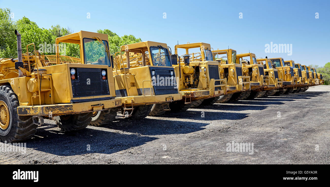 Heavy equipment tractor scrapers Stock Photo - Alamy