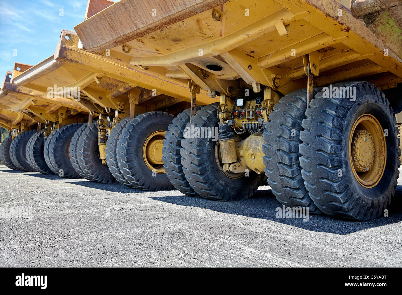 Heavy equipment industrial dump trucks Stock Photo - Alamy